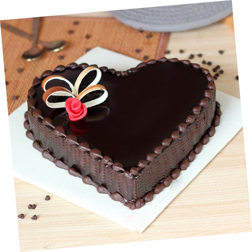 Enriched with exotic chocolates, this delicious heart-shaped cake is ...